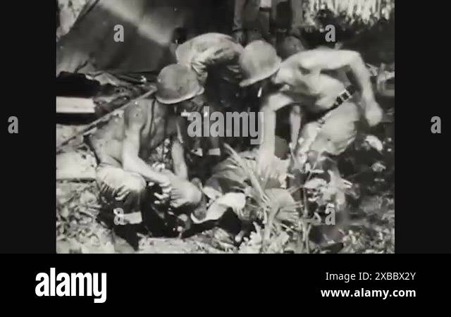 1943 American soldiers load wounded soldiers onto Ambo Peeps for ...