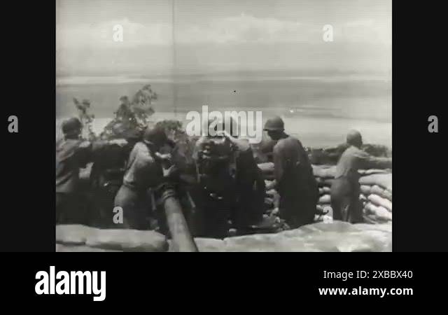 1943 American soldiers fire at Japanese soldiers flying overhead in the ...