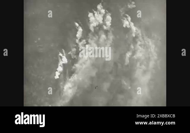 1943 American soldiers fire shots in the South Pacific jungle during ...