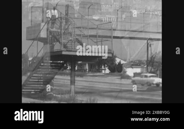 1950s - A brother and a sister use an overpass and tunnel while walking ...