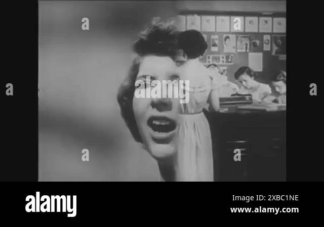 1950 - Students sing in a music class, and a diagram of the operations ...