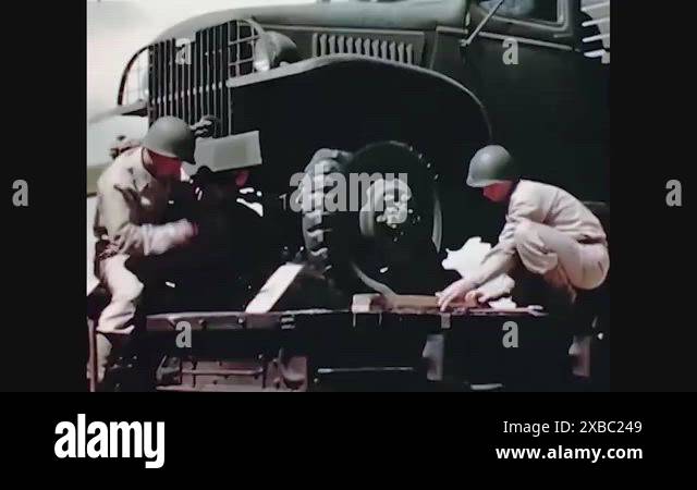 1944 - Soldiers secure tanks and trucks to trains, and soldiers climb ...