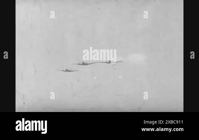1940 - German paratroopers jump from planes in a training exercise ...