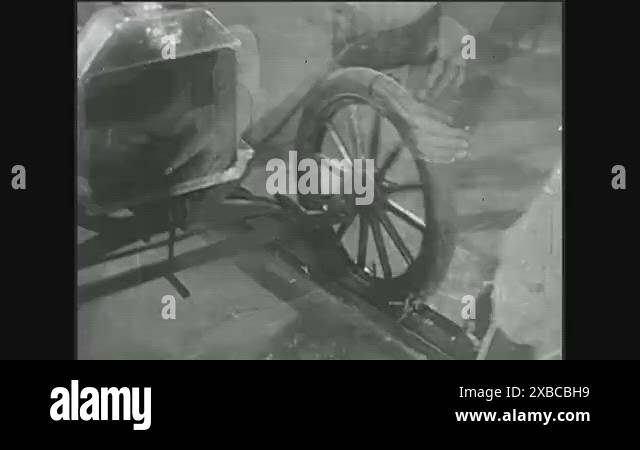 Specialists work on subassemblies and a conveyor belt is used as Model ...