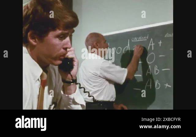 1971 - Medical sorting teams are rushed to the staging area of a multi ...