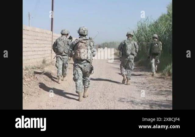 US soldiers interrogate a man in a town in the Middle East Stock Video ...