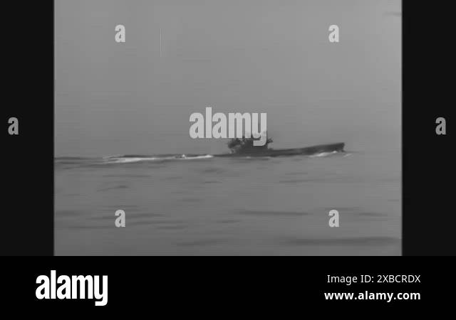 PORTSMOUTH - 1945 - German submarine crew members ride on top of a ...