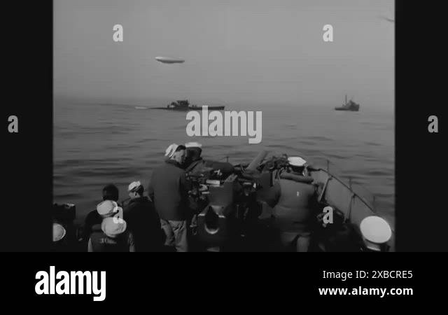 PORTSMOUTH - 1945 - Crewmembers of a US tugboat approach German ...