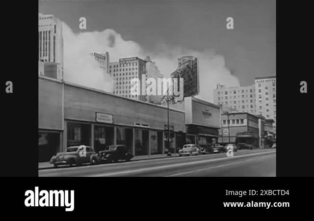 1950 - Two soldiers and a sailor take cover in an office building after ...