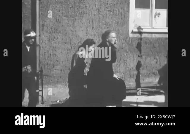 1945 - German soldiers and civilians are shown concentration camp ...