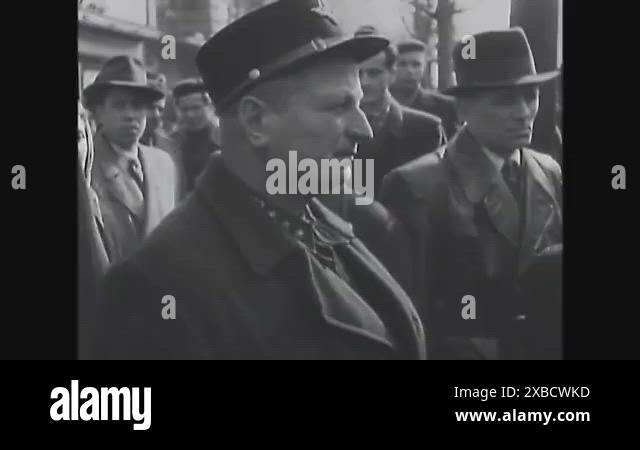 1953 - Russian men and women read commemorative newspapers about Stalin ...
