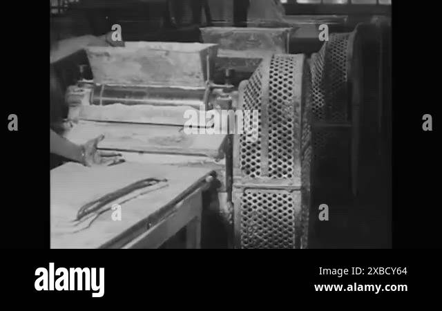Scenes from a chewing gum factory in 1919 - Women stamp, roll and ...
