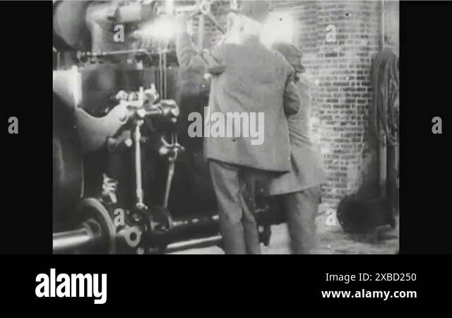 Henry Ford and John Burroughs work on an early steam engine in a ...