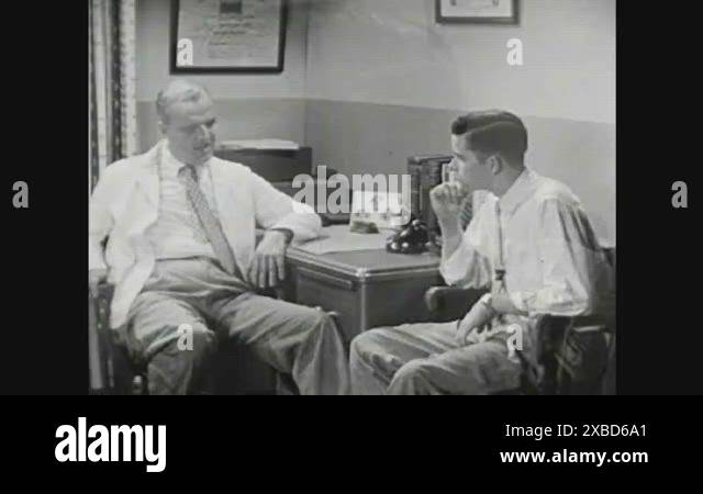 A doctor talks to a boy and his family about alcoholism and its effects ...