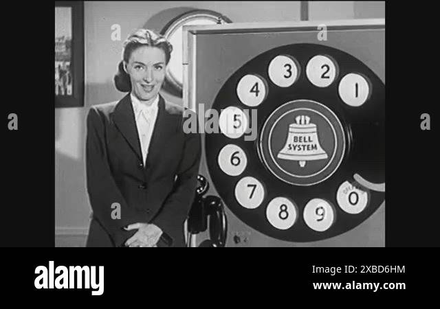 A woman shows us how to use the new rotary telephone and a telephone ...