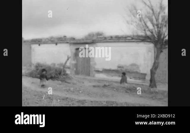 A woman gives birth in the 1960’s in a third world environment Stock ...