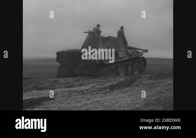 FRANCE - 1944 - US Soldiers operate and inspect a captured German tank ...