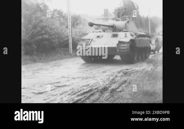 GERMANY - 1945 - Camouflage German tanks and soldiers get into firing ...