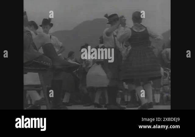 1930s footage of a peaceful traditional Austrian folk dance followed by ...