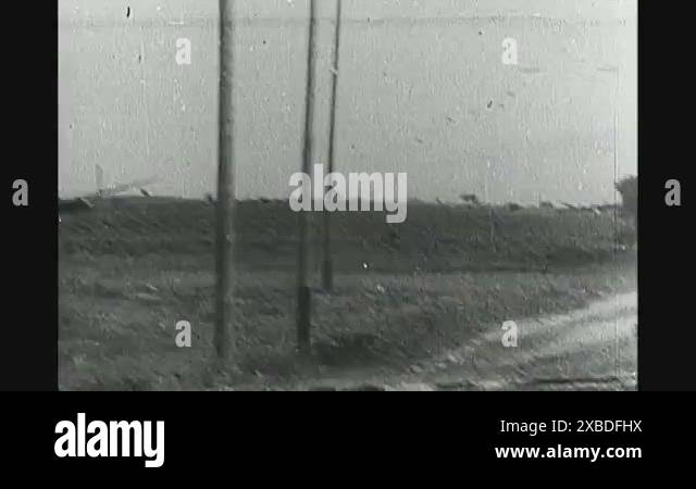 A Nazi plane drops paratroopers, the dead are piled up and ...