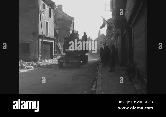 ISIGNY - 1944 - US soldiers on a bulldozer clear debris from destroyed ...