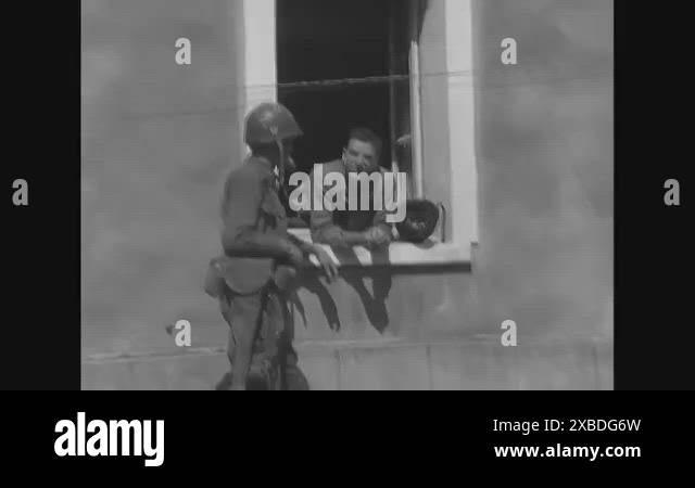 FRANCE - 1944 - An American soldier and a captain handle a German Luger ...