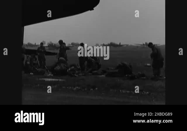 BELGIUM - 1944 - 82nd Airborne Division paratroopers help each other ...