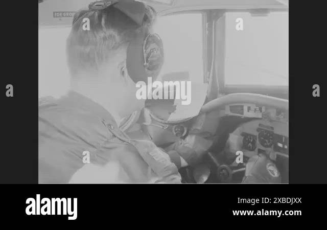 1964 - The pilot and co-pilot of a USAF C-54A, Captains Carter and Bogosh, are seen in the ...