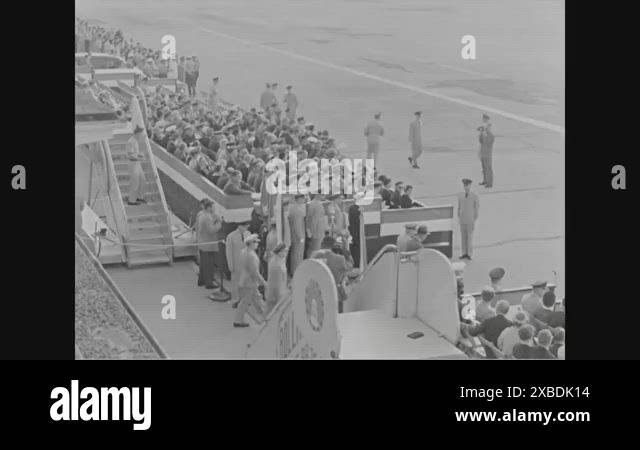 1960 - C-118A planes are parked on the runway with color guards posing ...