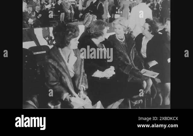 1965 - General LeMay's wife and daughter are seated in a hangar at ...