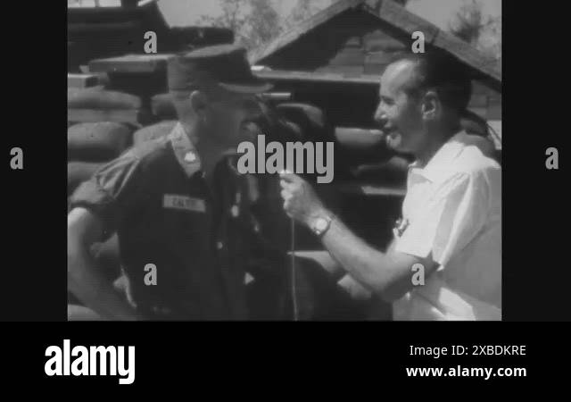 1966 - Canadian reporter Larry Henderson interviews a US Army major ...