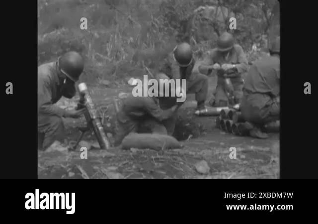 SOUTH KOREA - 1951 - Soldiers load ammunition into mortars and fire in ...