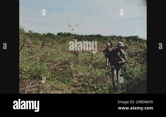 1966 - American soldiers of the 25th Infantry Division trek through a ...