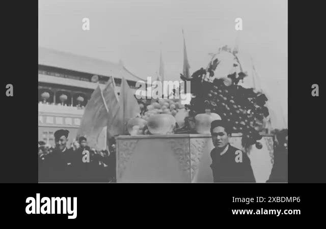 1940s, May Day Parade, China, Mao Zedong raises his hat to joyful ...