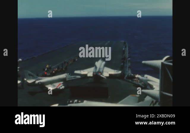 1966 - US Navy fighter jets take off from the flight deck of the USS ...