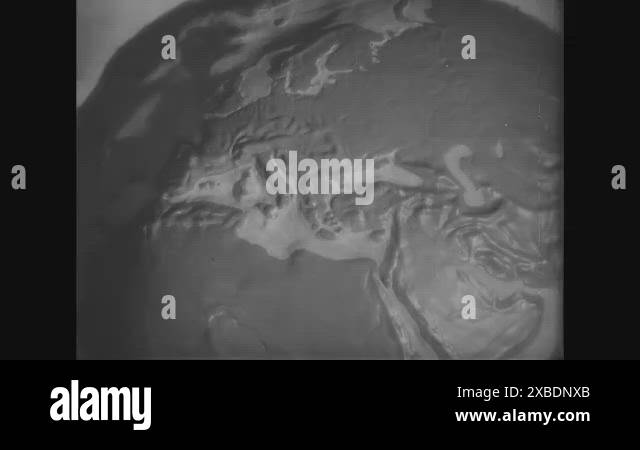 1940 - A globe and map are used to show America's population in ...