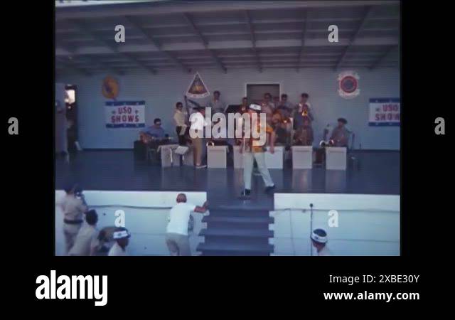 1967 - Raquel Welch sings Different Drum for USAF airmen in a USO show at an air base in Takhli ...