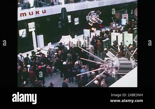1968 - Russians visit an exhibit about the Soviet space program where ...