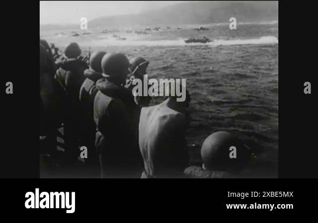 1944 - US Navy battleships fire on an island in the Pacific to allow ...