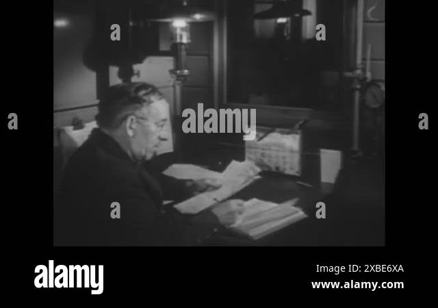 1942 - A freight train conductor keeps track of all the cars from the ...