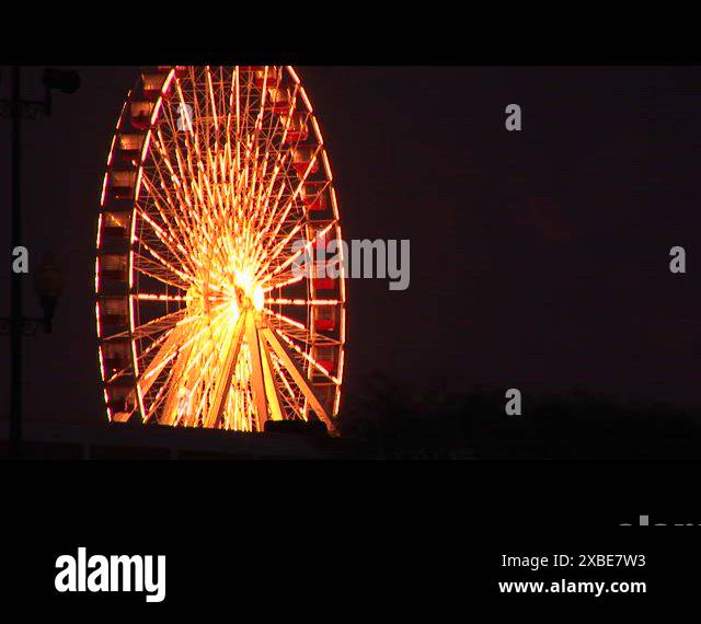 Eye-catching lighting on a ferries wheel is sure to catch attention of ...