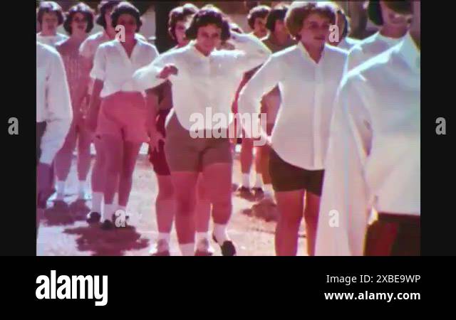 1963 - Elementary school students and teenagers march in place and do ...