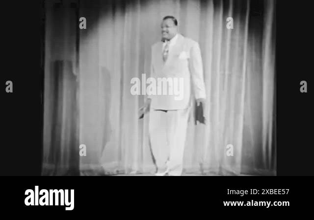 1949 - Singer Dick Barrow concludes a performance of Fat Man Blues in a ...