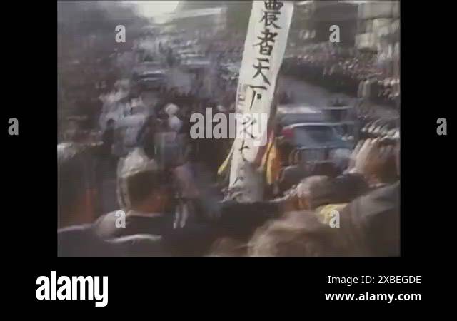 President Lyndon Johnson greets crowds from a motorcade and ...