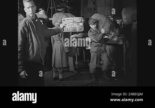 1945 - American soldiers disembarking from the USS Wasp check in with ...