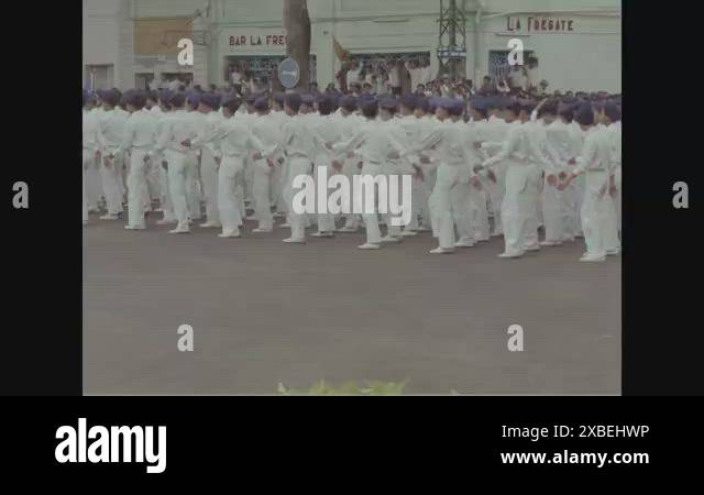 1962 - Students and servicemen march in a Saigon parade celebrating ...