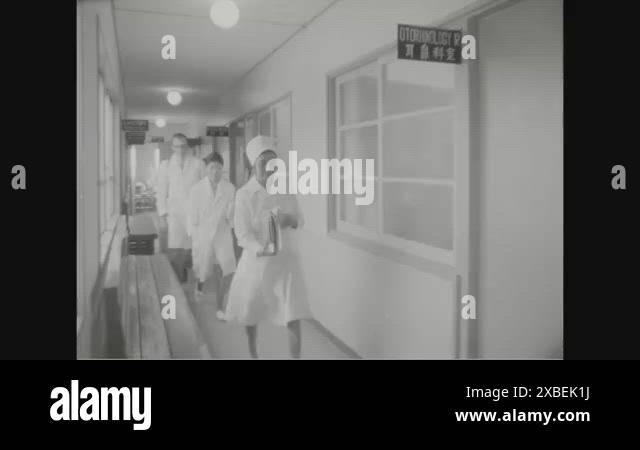 1960s - Doctors and nurses head for the physical therapy wing of a ...