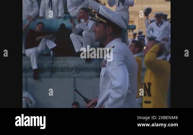 1968 - Three young men pump up the crowd at the U.S. Naval Academy ...