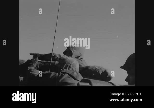 United States Marines are shown in a fighting hole on a hilltop during ...