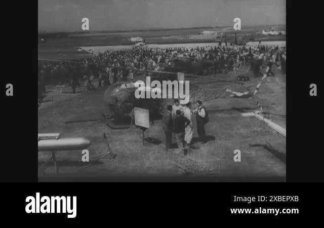 1963 - A new helicopter, jet, and jet pack are demonstrated at an air ...